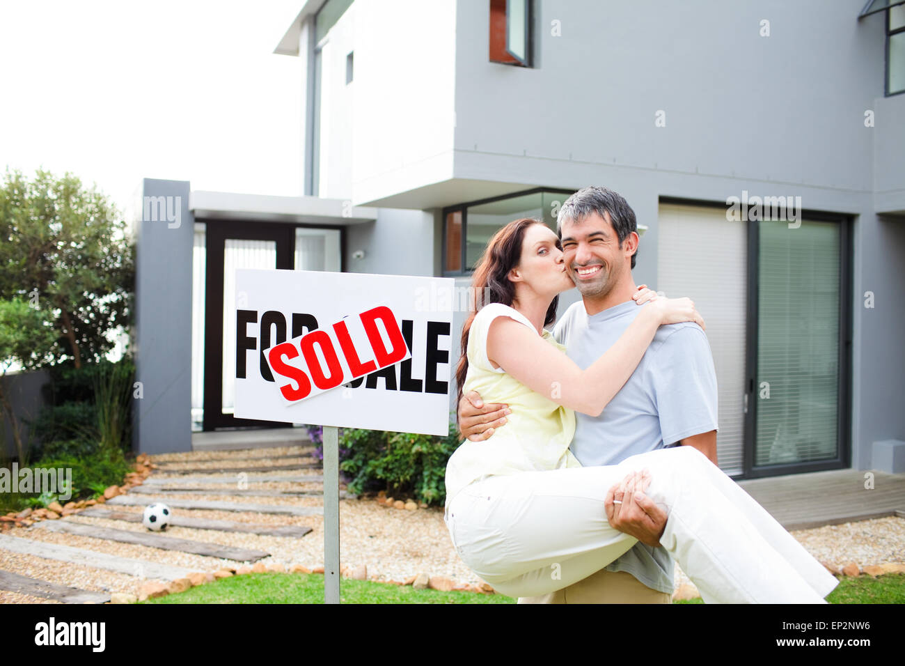 Couple celebrating their new house Stock Photo - Alamy