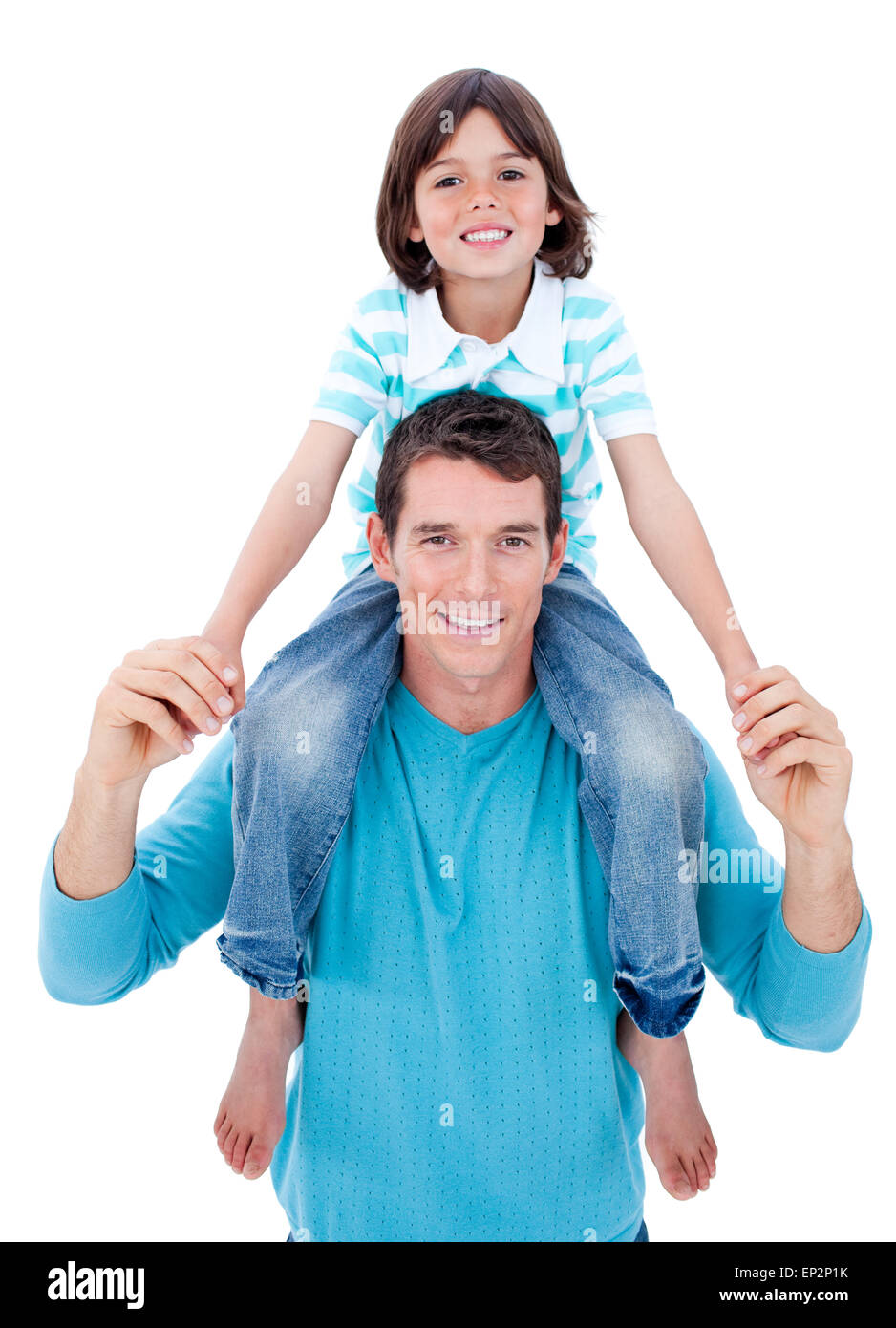 Tender child enjoying piggyback ride with his father against a white ...