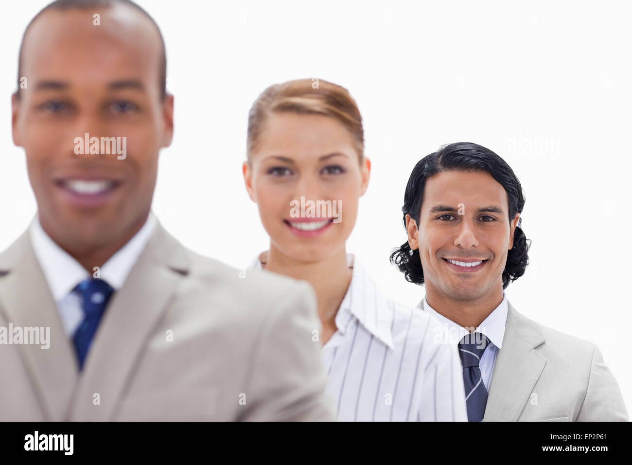 Big close-up of workmates smiling in a single line Stock Photo - Alamy