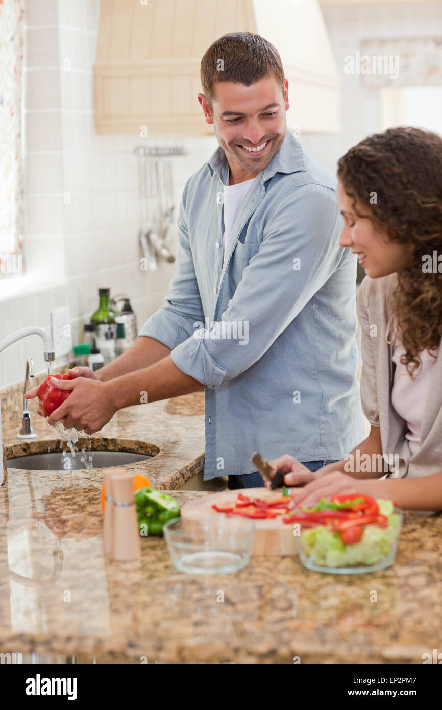 Handsome man cooking with his girlfriend Stock Photo - Alamy