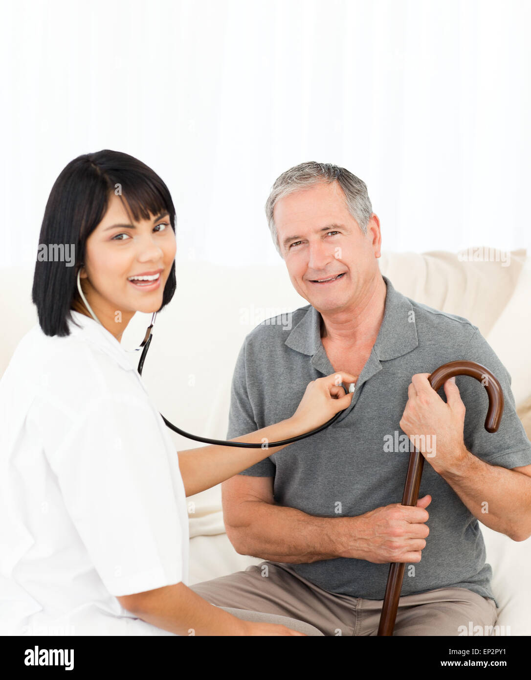 Nurse with her patient looking at the camera Stock Photo - Alamy