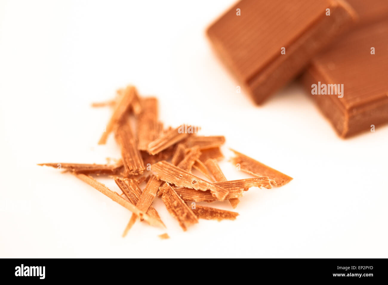 Blurred chocolate pieces and chocolate shaving Stock Photo - Alamy