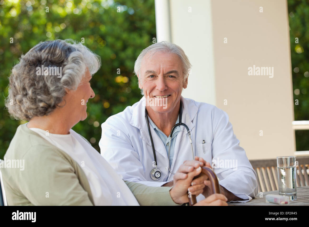 Senior doctor talking with his mature patient Stock Photo - Alamy