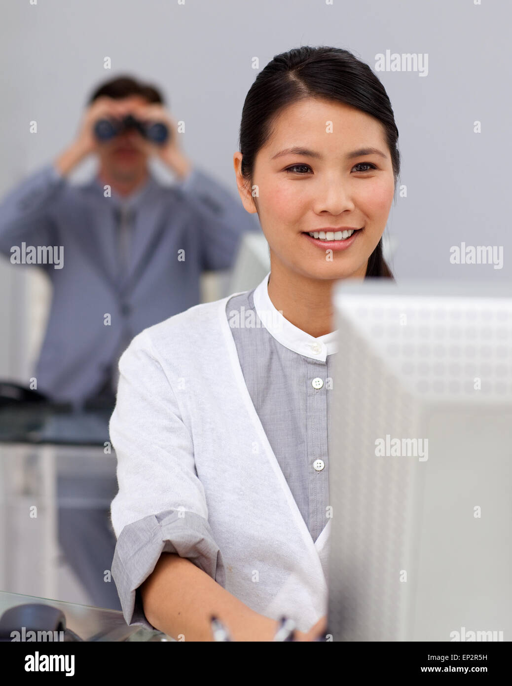 Self-assured asian businesswoman at a computer Stock Photo - Alamy