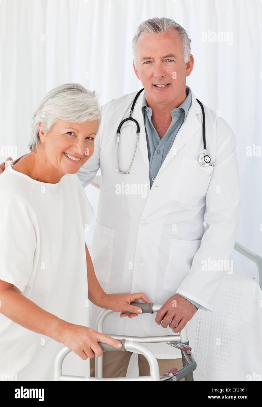 Patient with her doctor looking at the camera Stock Photo - Alamy