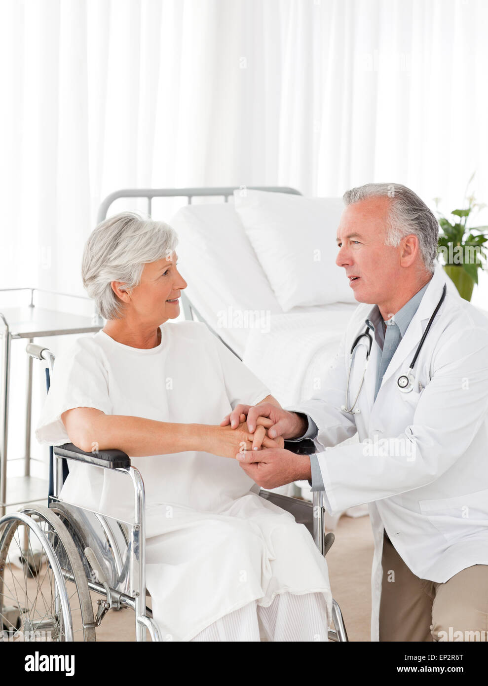 Doctor speaking with his patient Stock Photo - Alamy