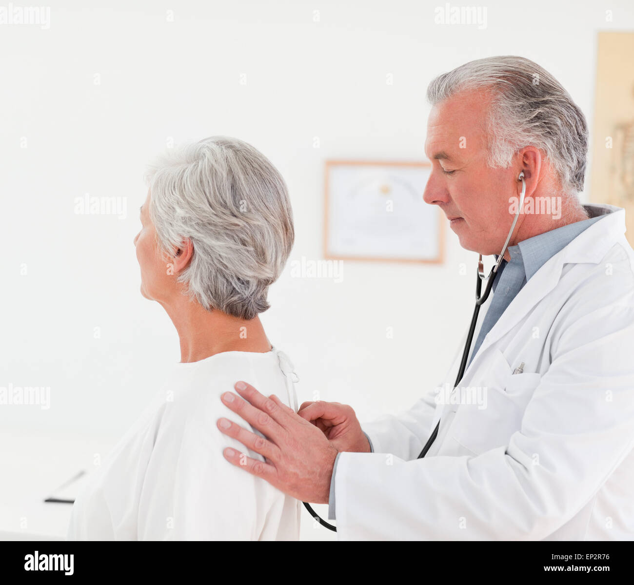 Doctor examining his patient Stock Photo - Alamy