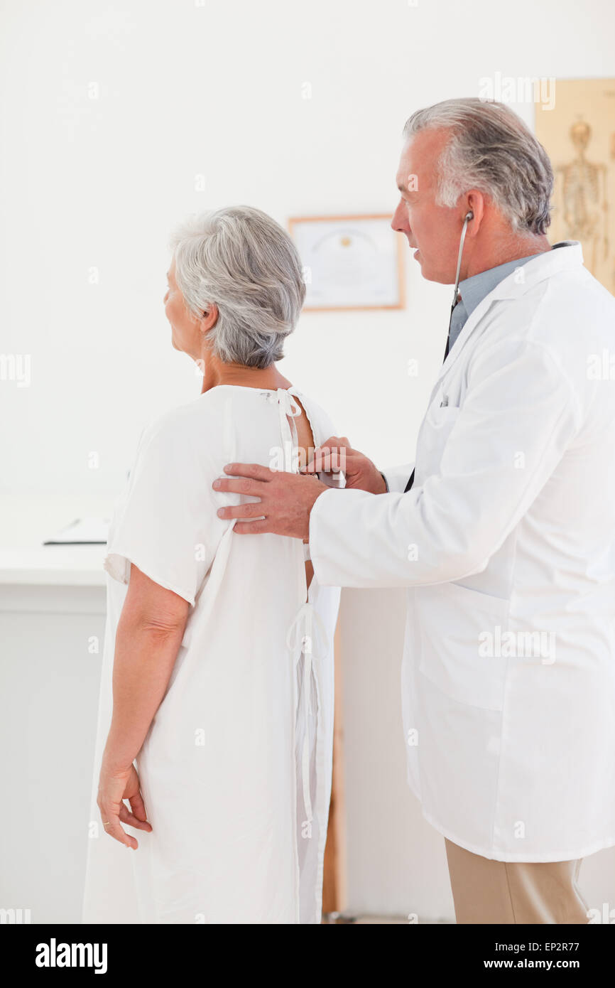 Doctor examining his patient Stock Photo - Alamy