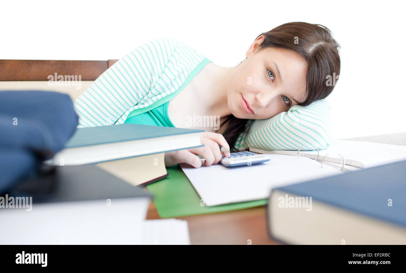 Attractive tired woman studying on a table Stock Photo - Alamy
