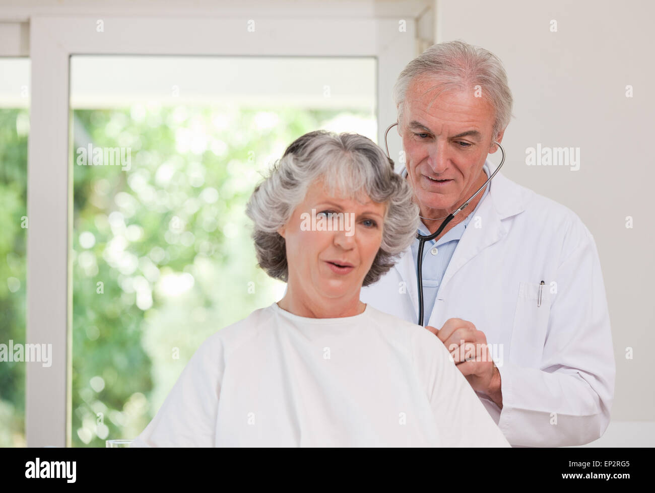 Doctor examining his patient Stock Photo - Alamy