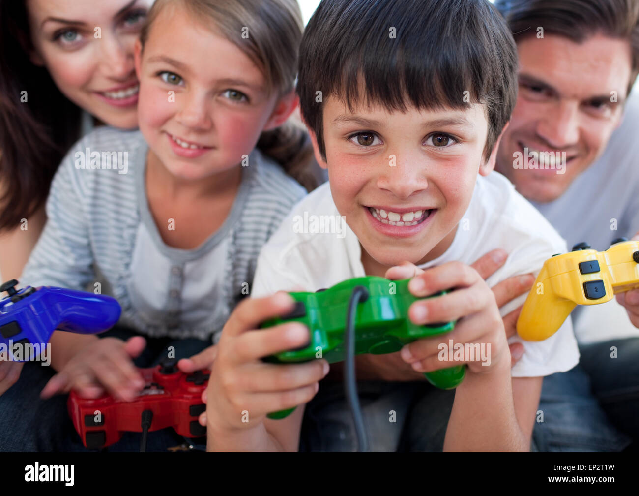 Excited Family playing video games Stock Photo - Alamy