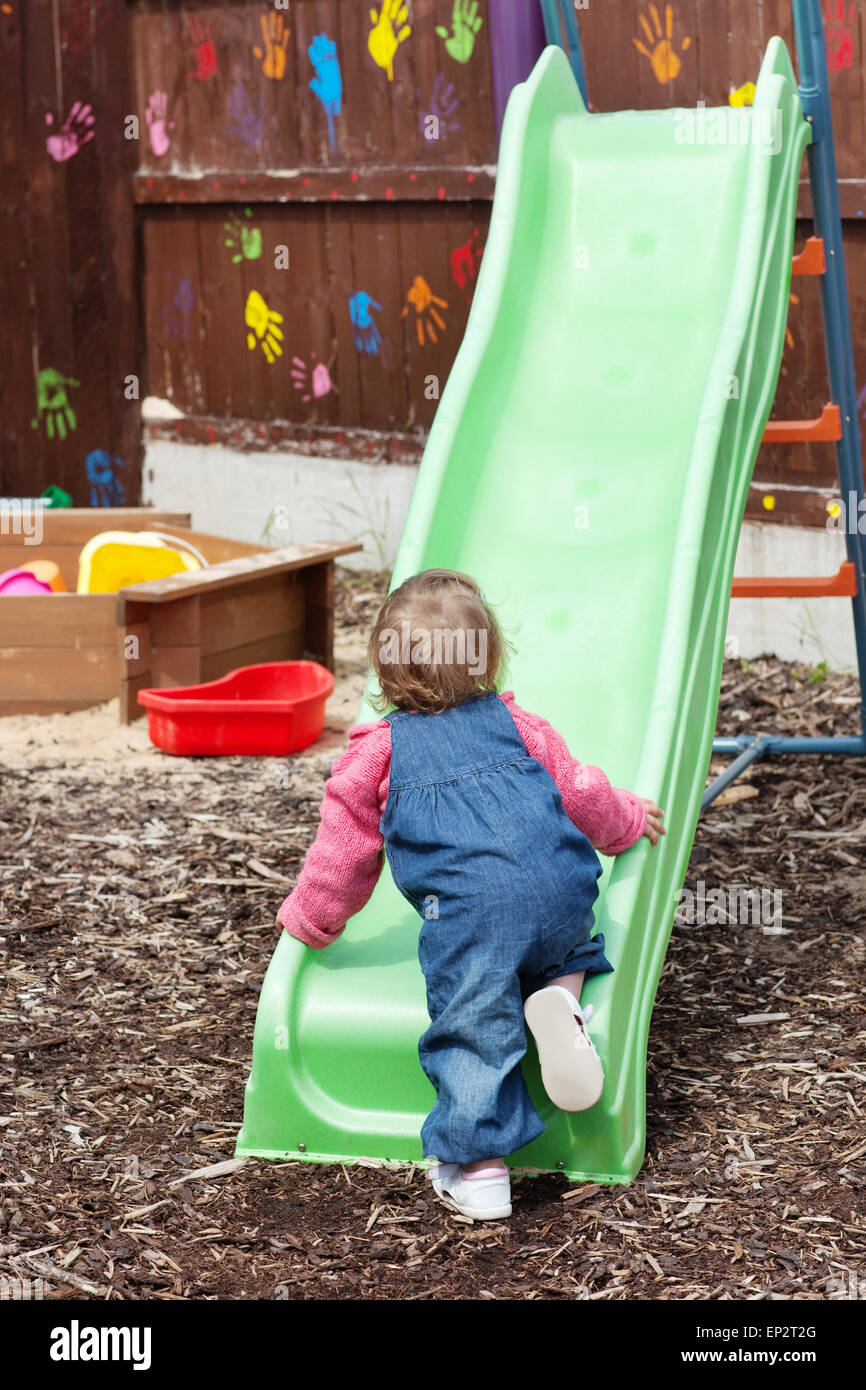 Little girl having fun with a chute Stock Photo - Alamy