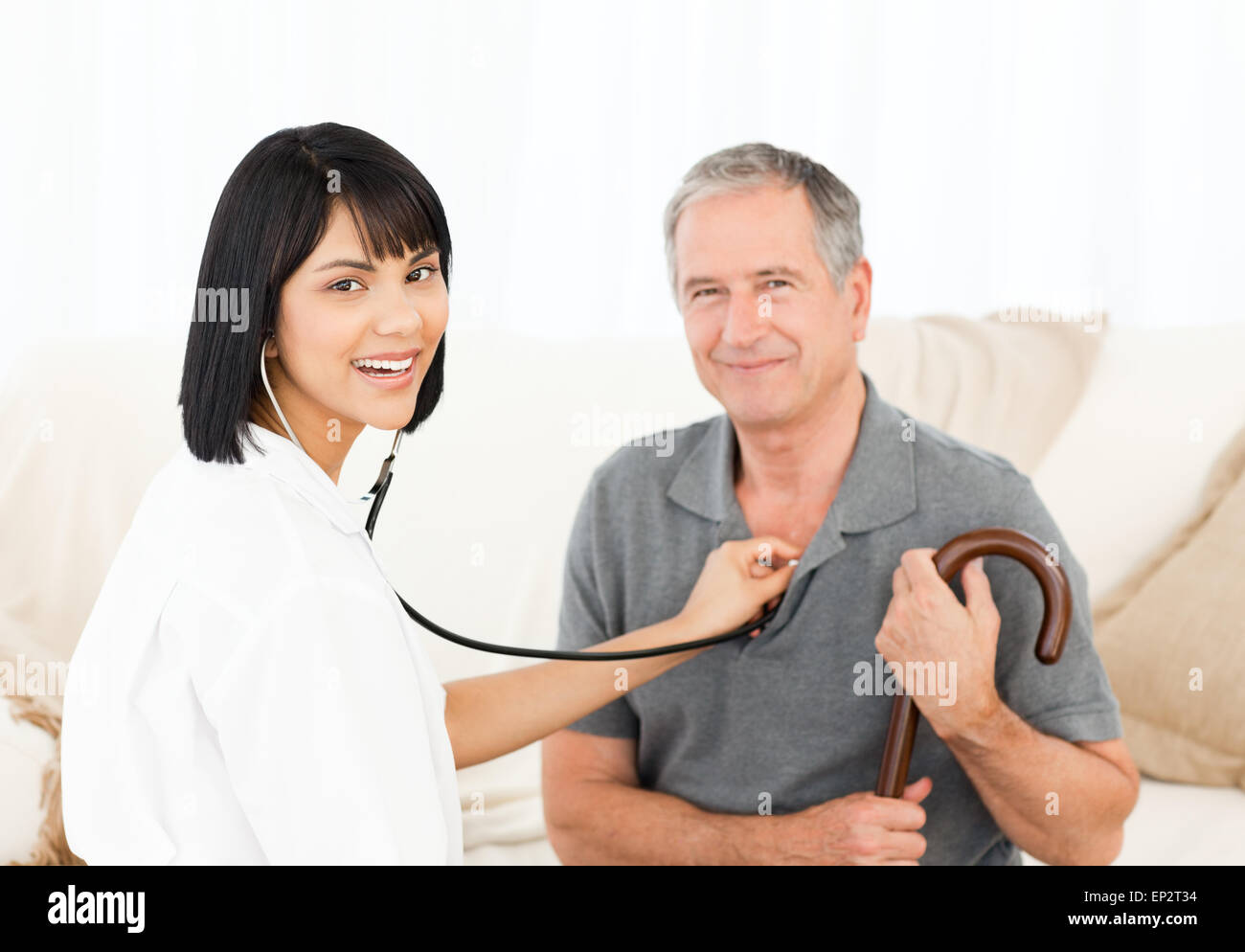 Nurse with her patient looking at the camera Stock Photo - Alamy