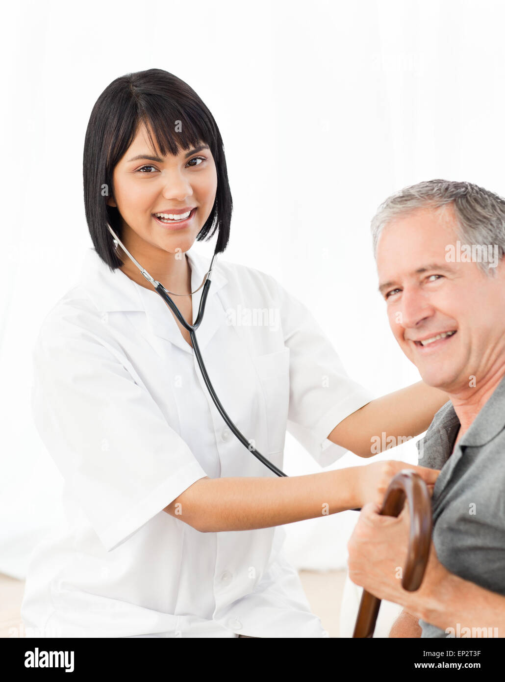 Nurse with her patient looking at the camera Stock Photo - Alamy