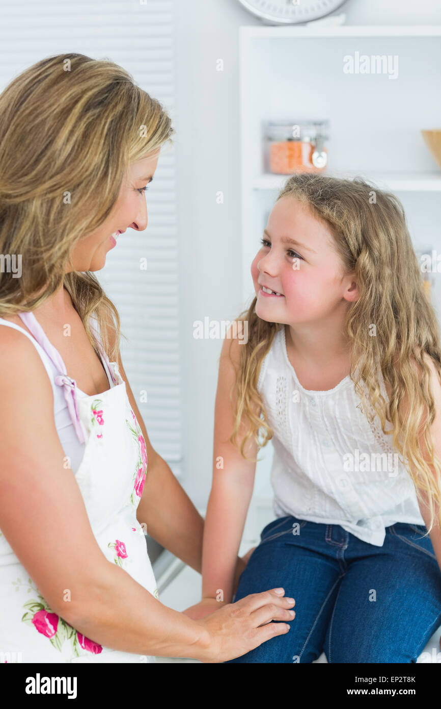 Mother and daughter looking into each other's eyes Stock Photo - Alamy