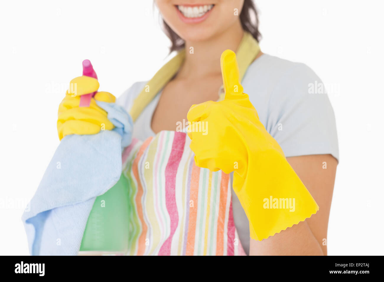 Woman giving thumbs up holding cleaning products Stock Photo - Alamy