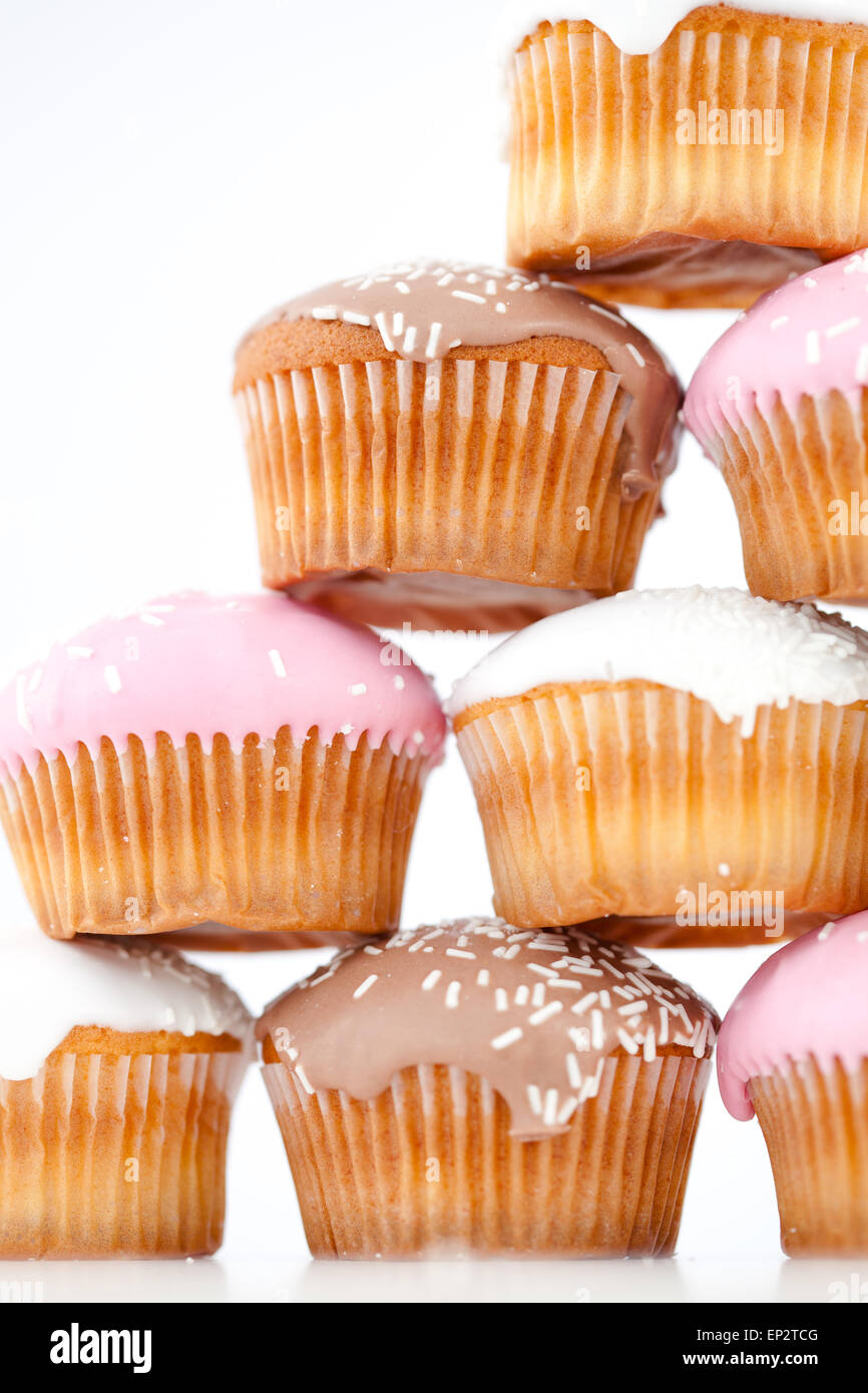 Close up on eight muffins with icing sugar placed in pyramid Stock ...