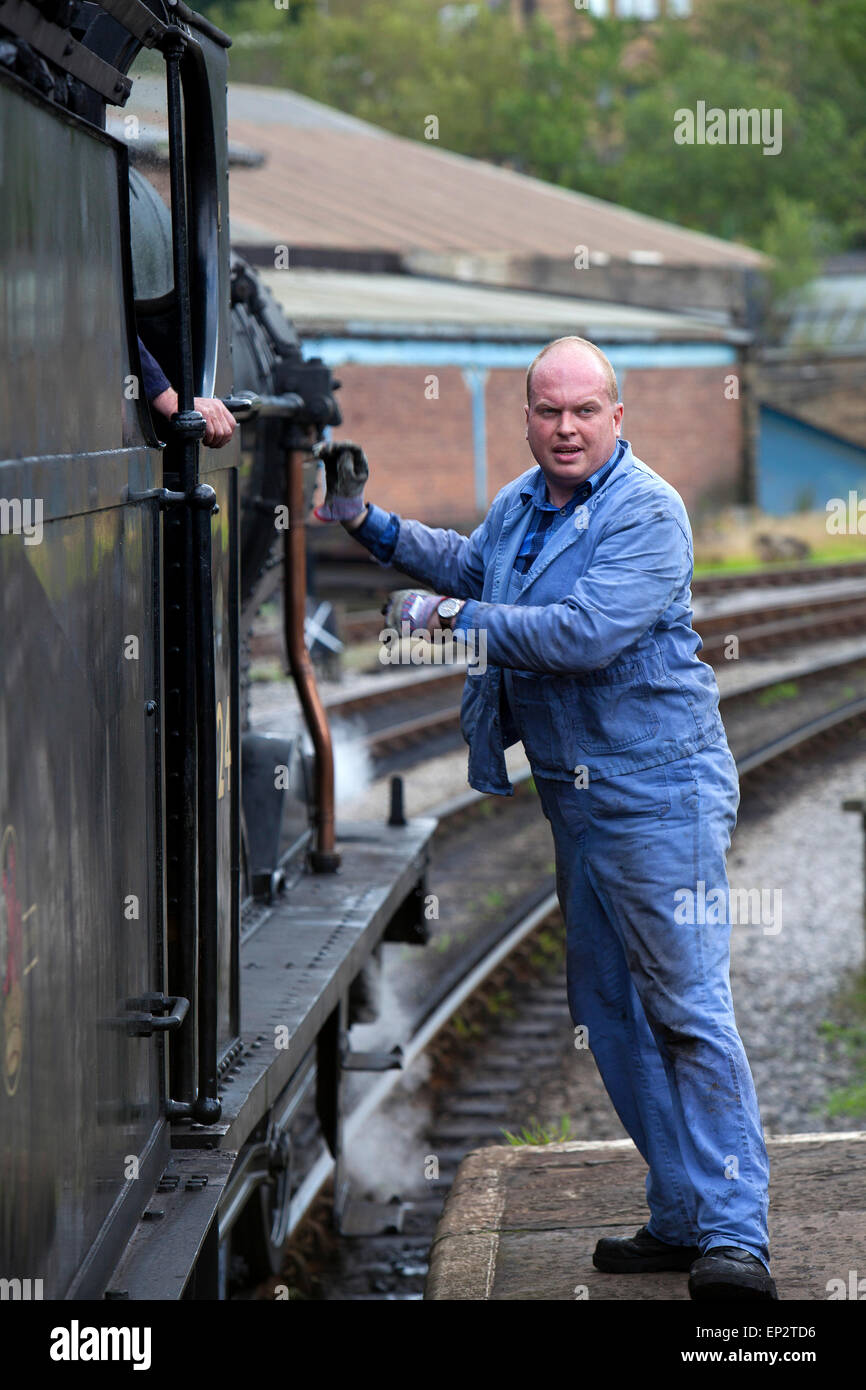 train driver on a steam locomotive at the Keighley and Worth Valley ...