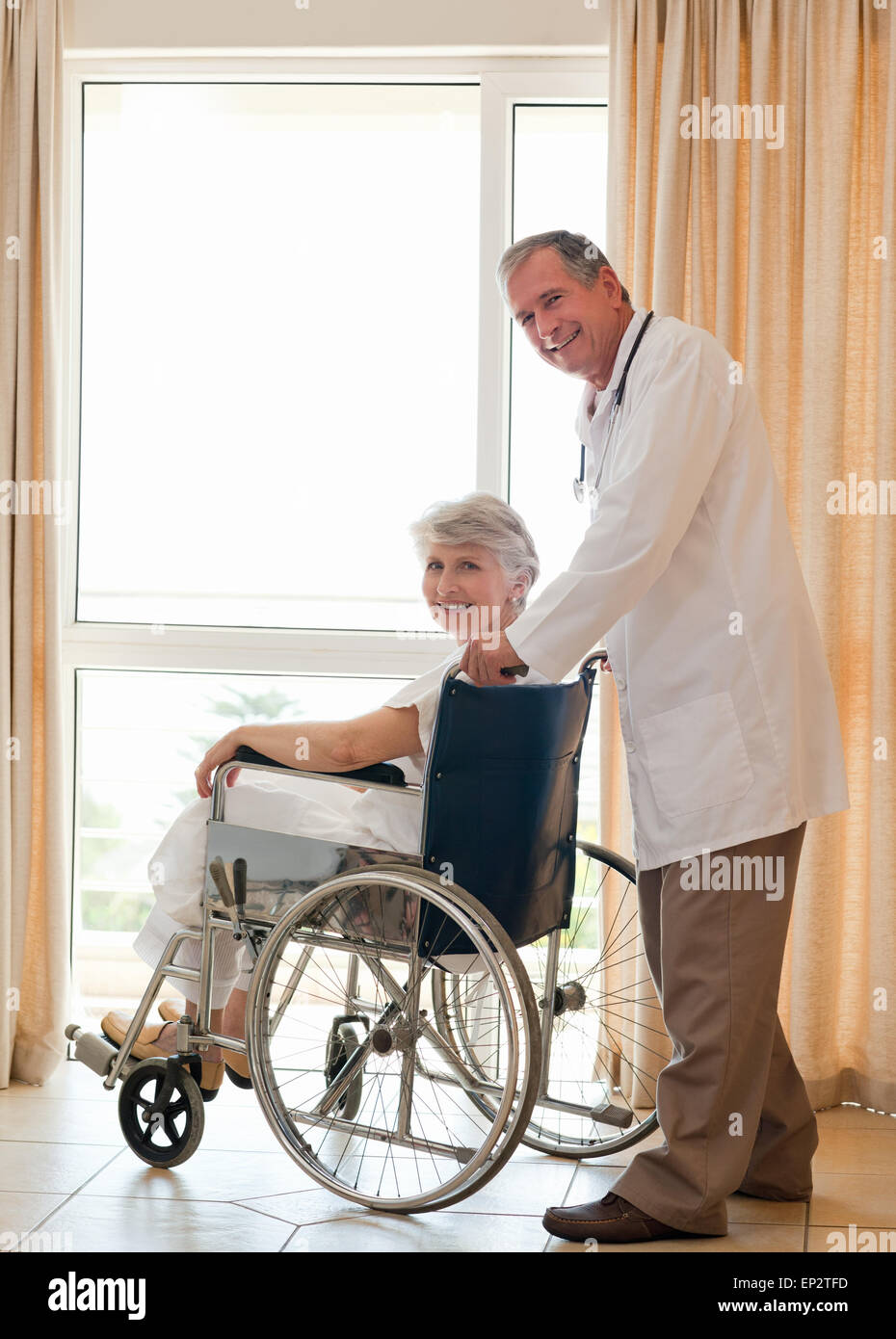 Doctor with his patient looking at the camera Stock Photo - Alamy