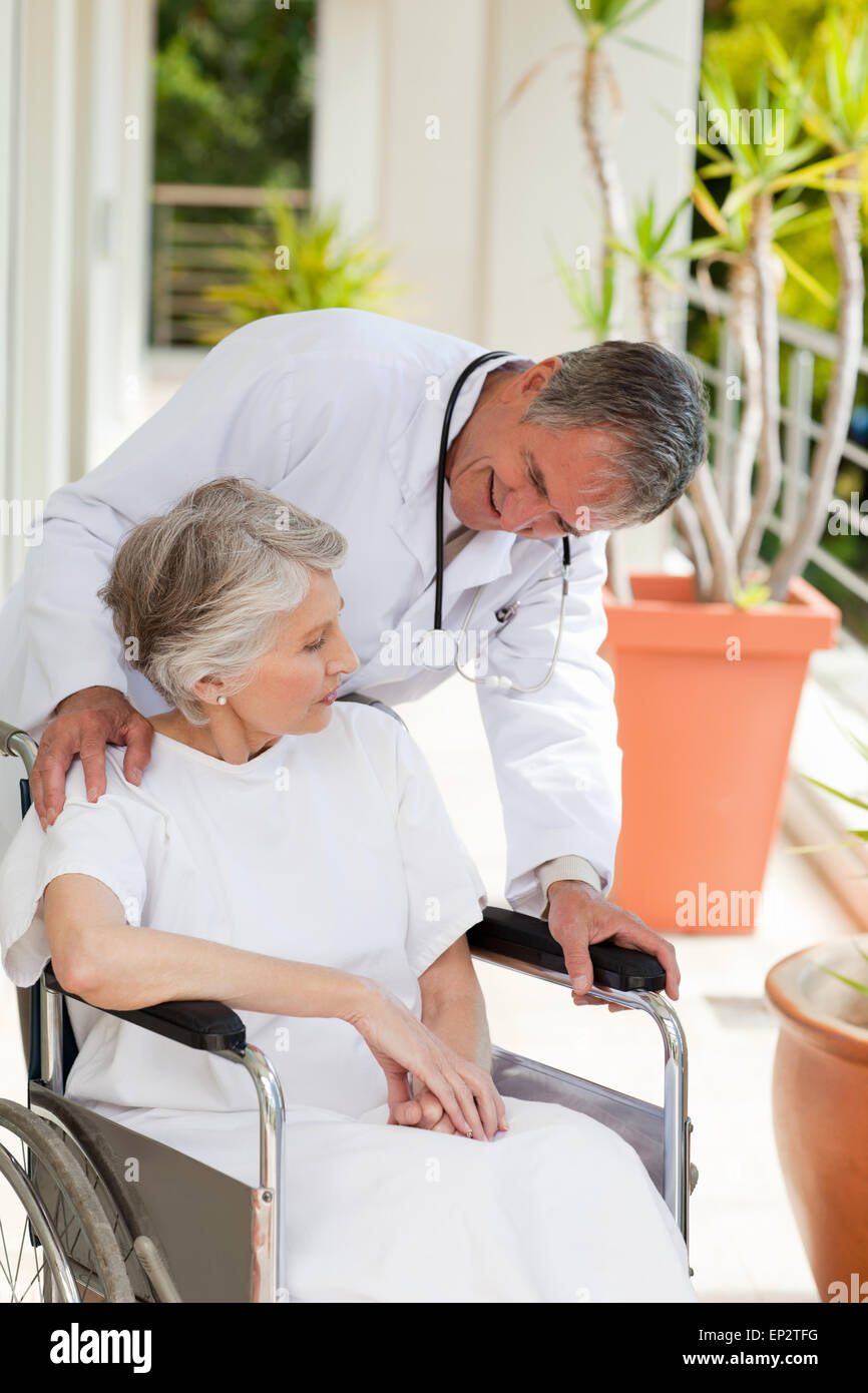 Senior doctor talking with his patient Stock Photo - Alamy