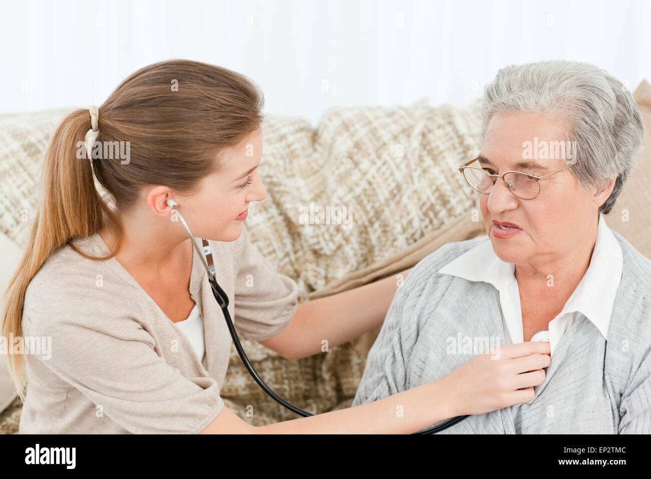 Nurse taking the heartbeat of her patient Stock Photo - Alamy