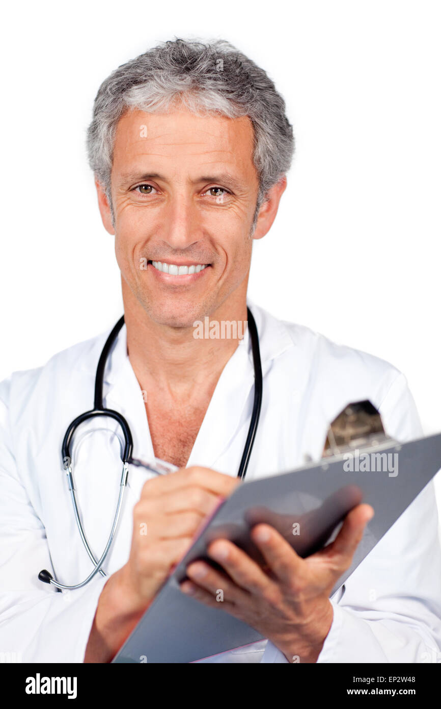Smiling doctor writting documents Stock Photo - Alamy