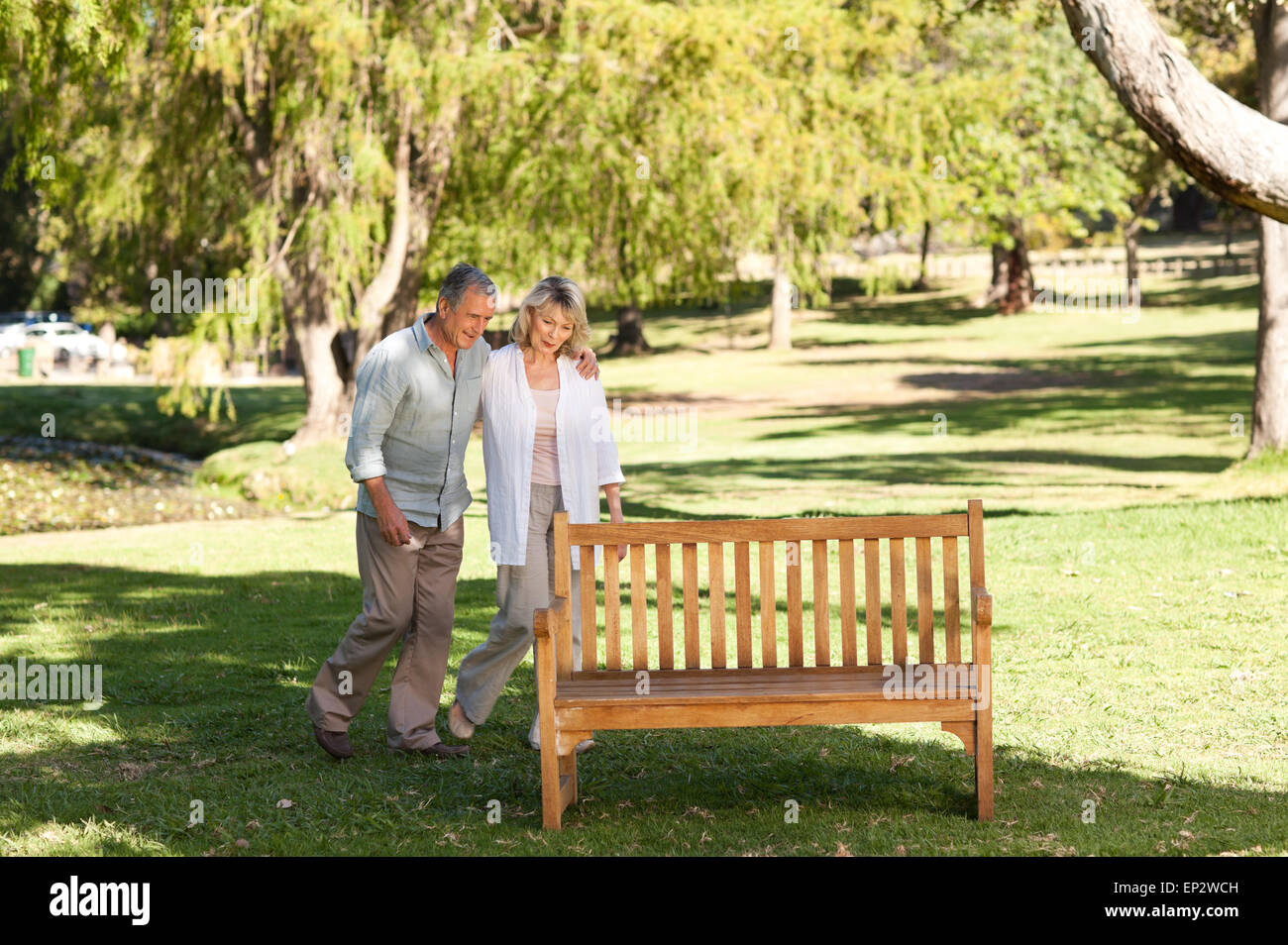 Portrait of a lovely couple behind the bench Stock Photo - Alamy