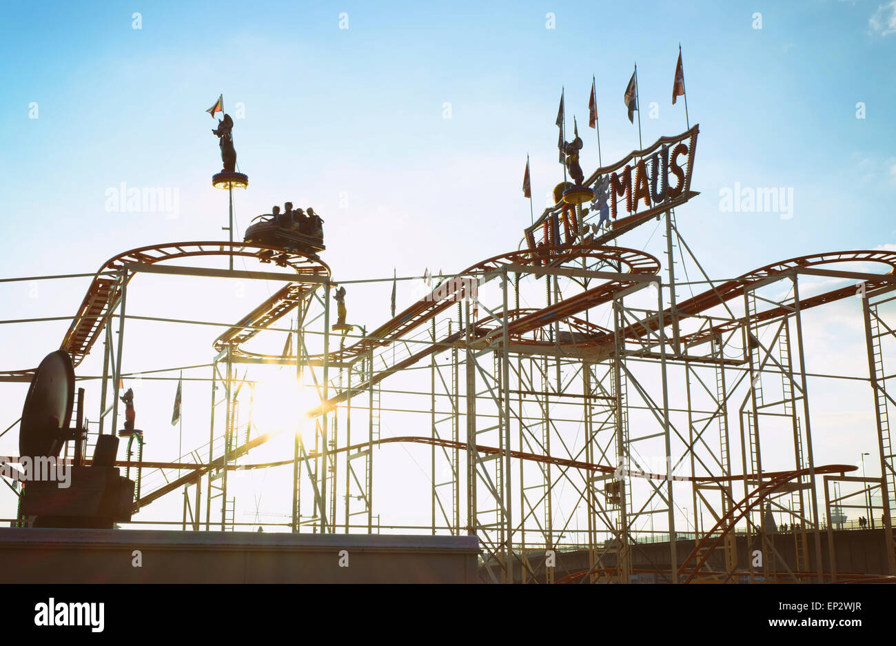 Germany, Colgone, ride at fun fair in sunset Stock Photo - Alamy