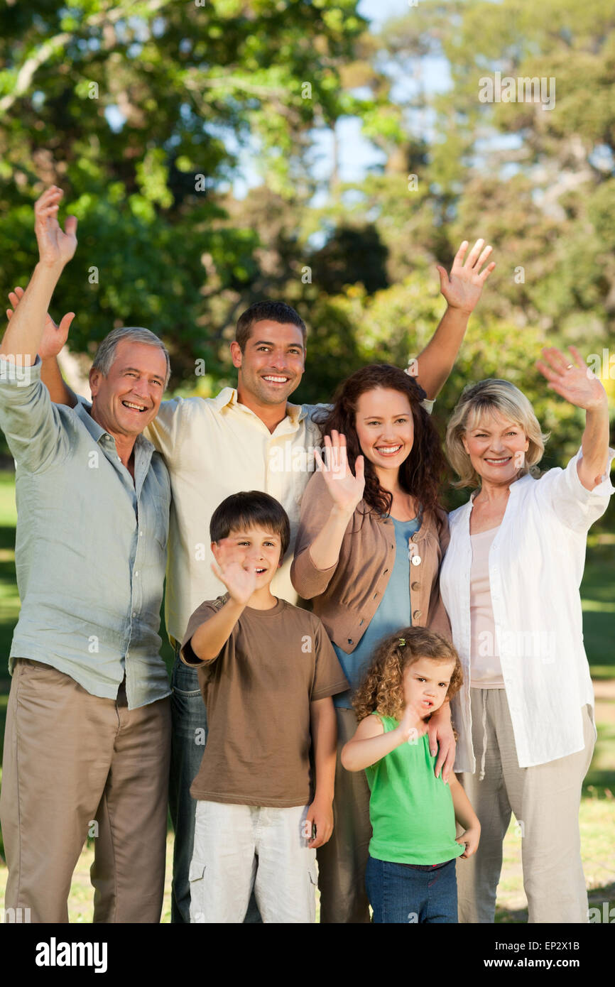Family looking at the camera in the park Stock Photo - Alamy