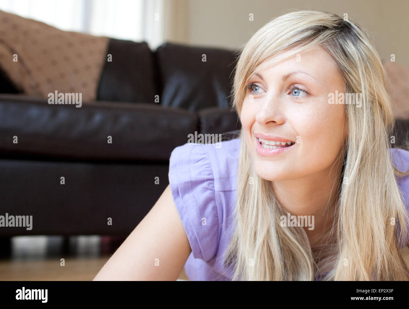Portrait of a beautiful woman lying on the floor Stock Photo - Alamy