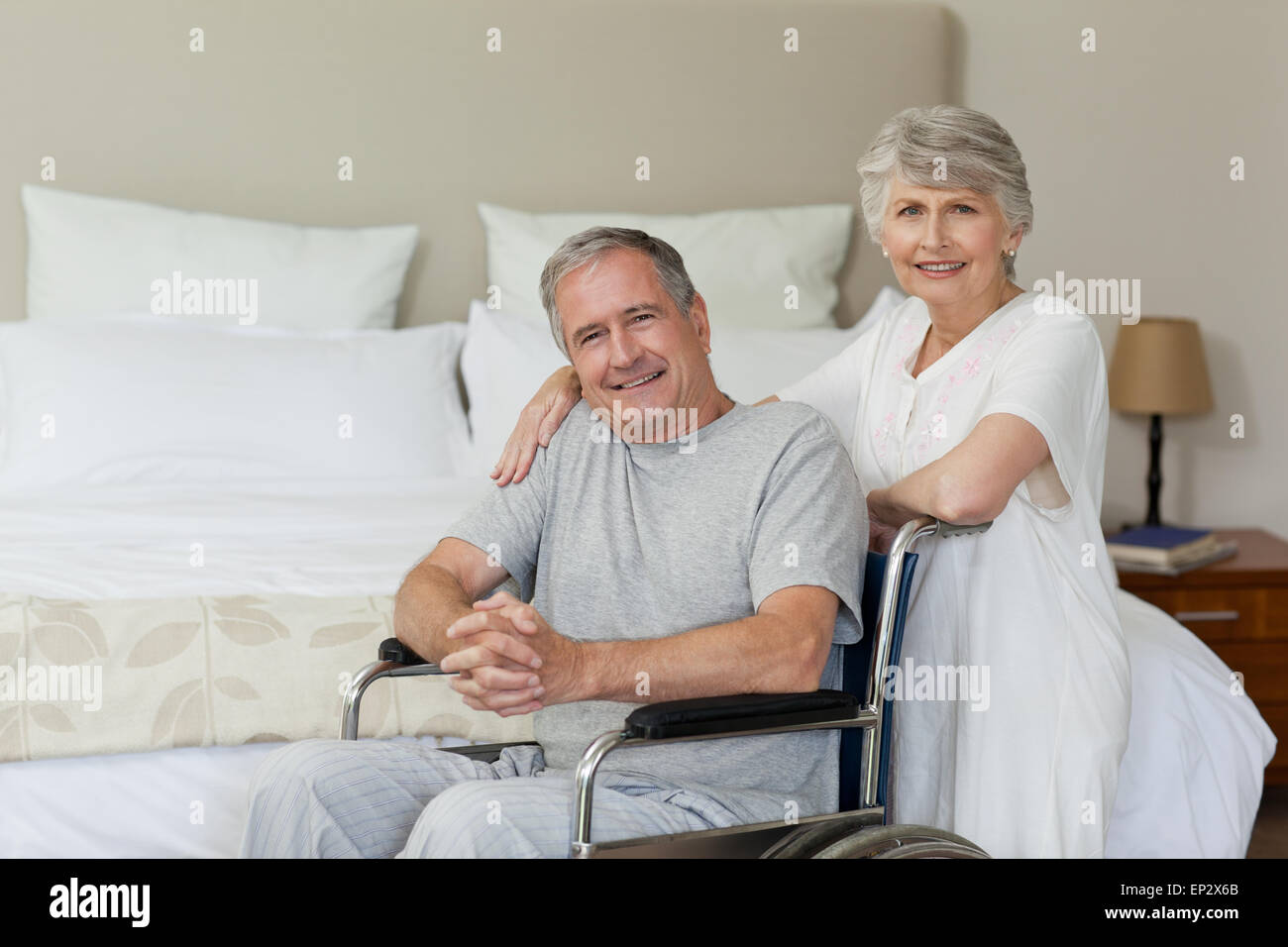 Mature couple in their bedroom Stock Photo - Alamy