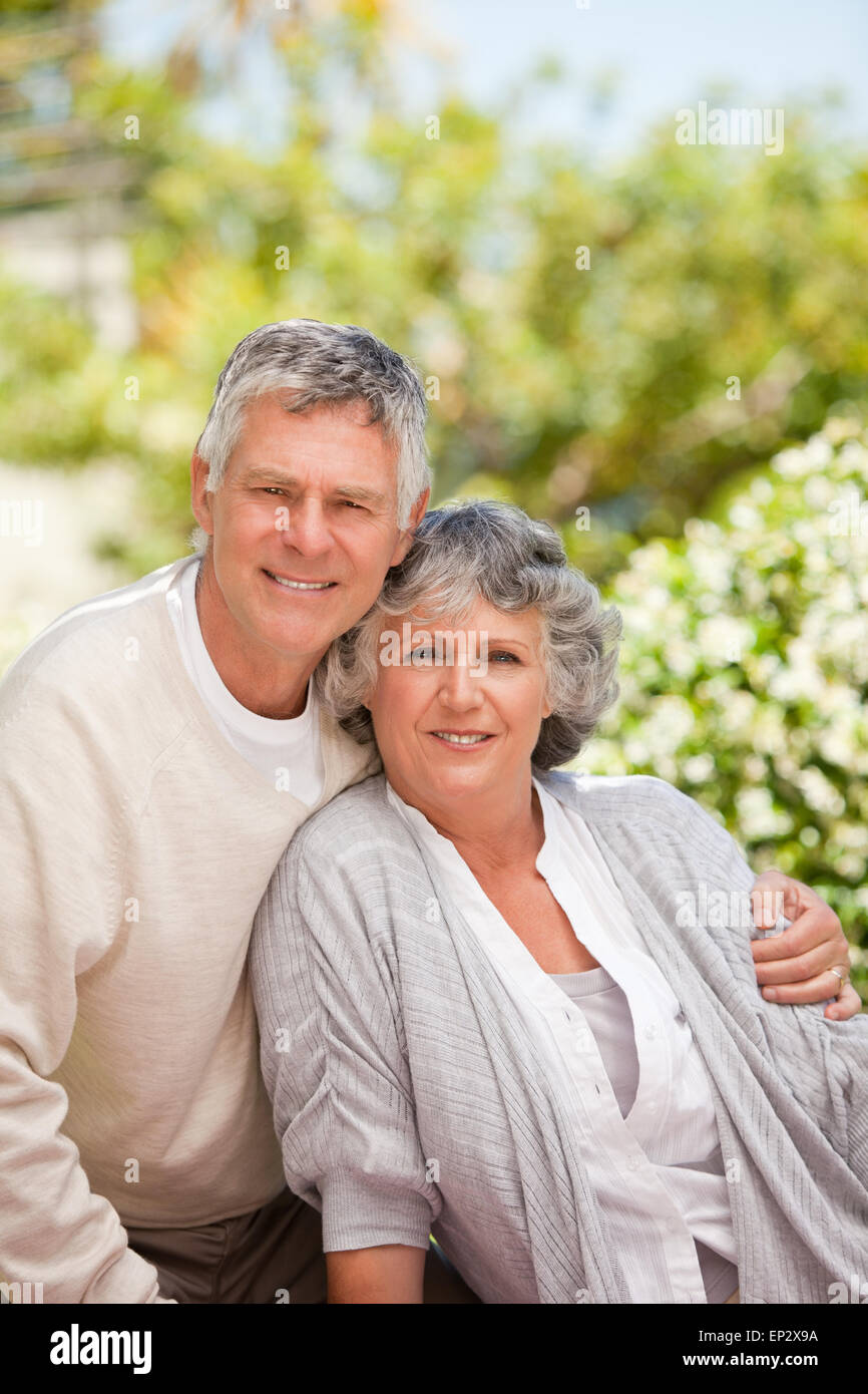 Retired couple looking at the camera Stock Photo - Alamy