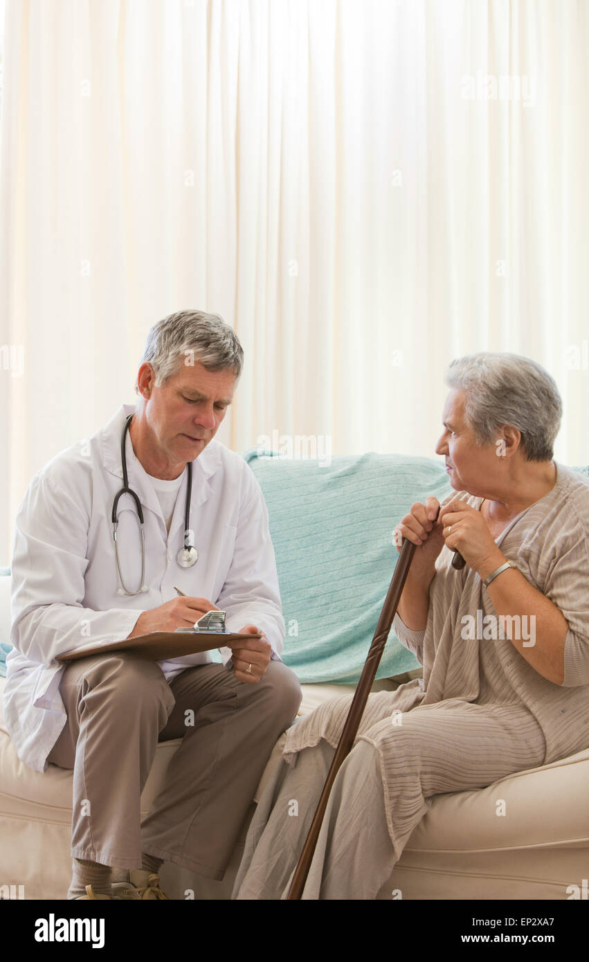 Senior doctor talking with his patient Stock Photo - Alamy