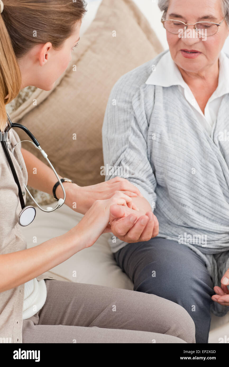 Beautiful nurse taking pulse patient hi-res stock photography and ...