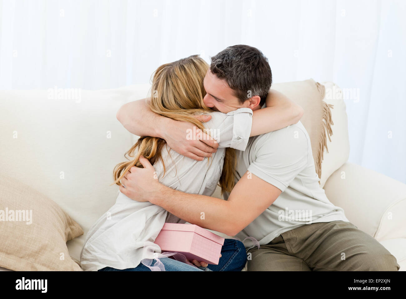 Happy pairs hugging Stock Photo - Alamy