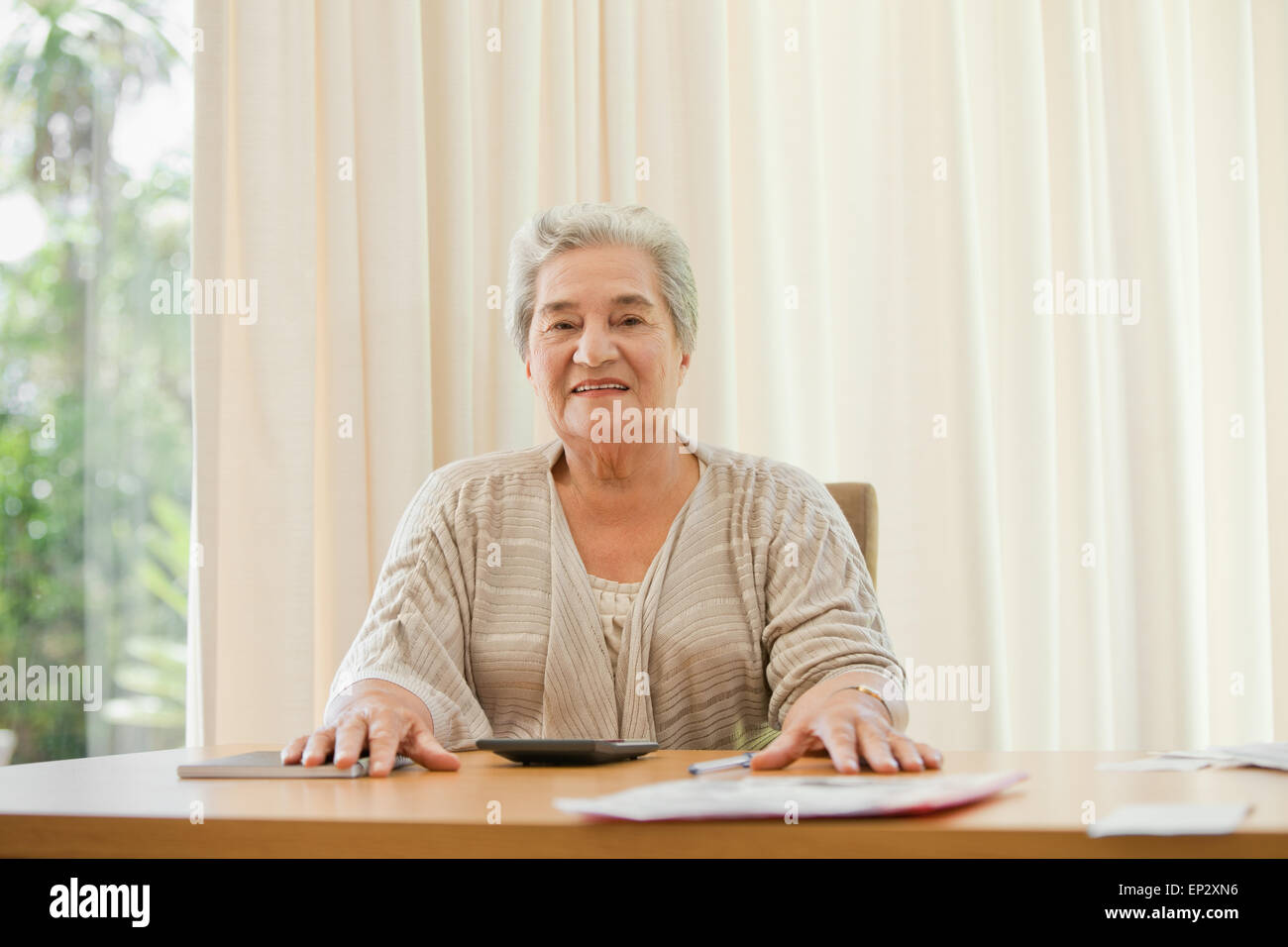 Radiant woman looking at the camera Stock Photo - Alamy