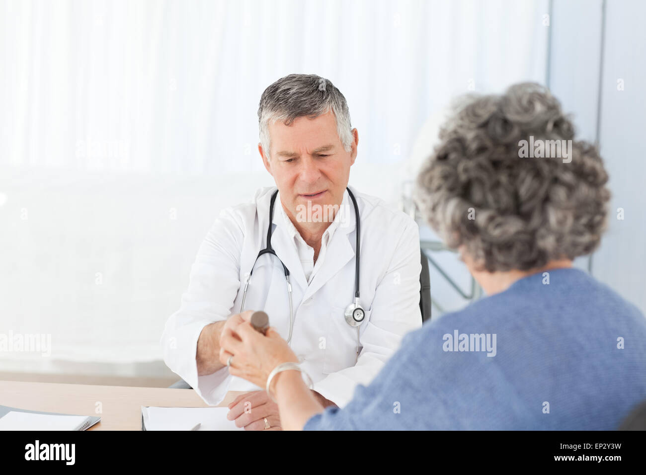 A senior doctor with his patient Stock Photo - Alamy