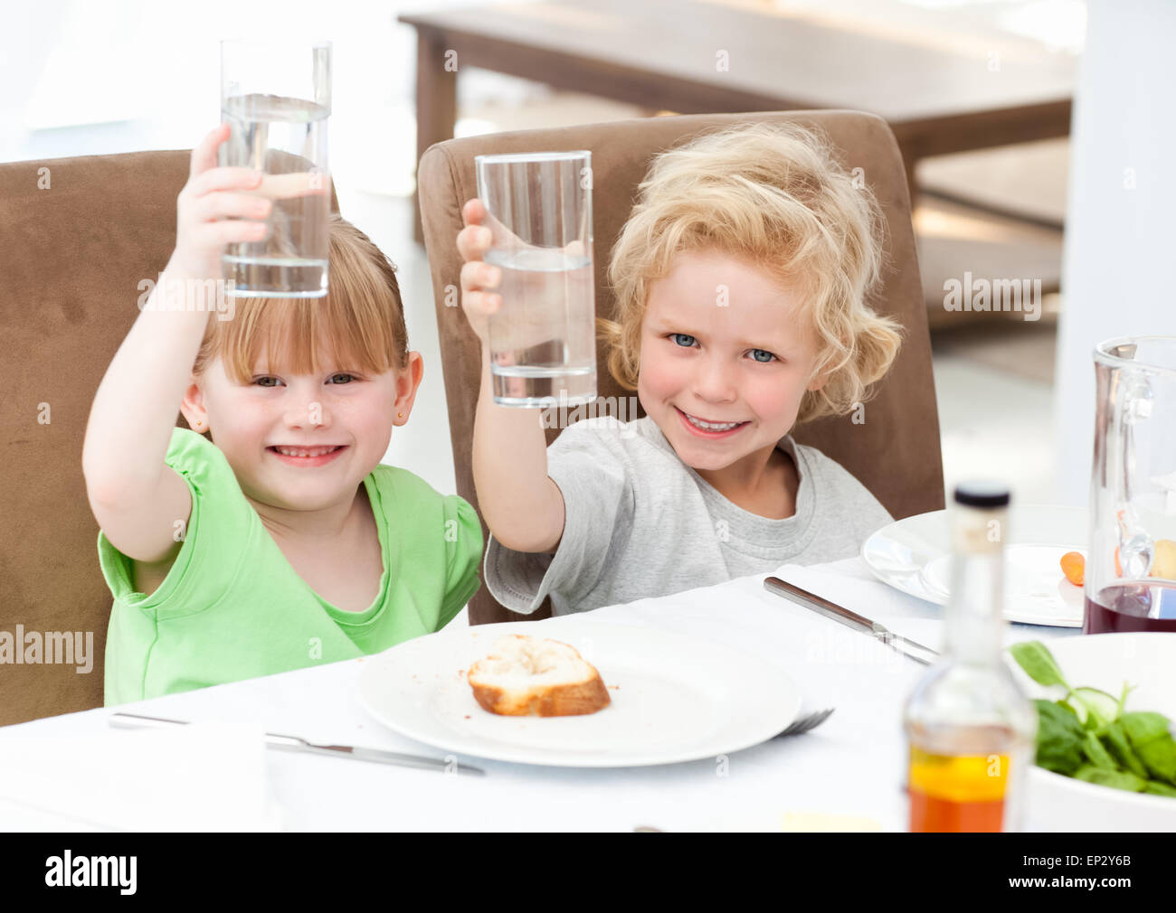 Children toasting with their drink Stock Photo - Alamy