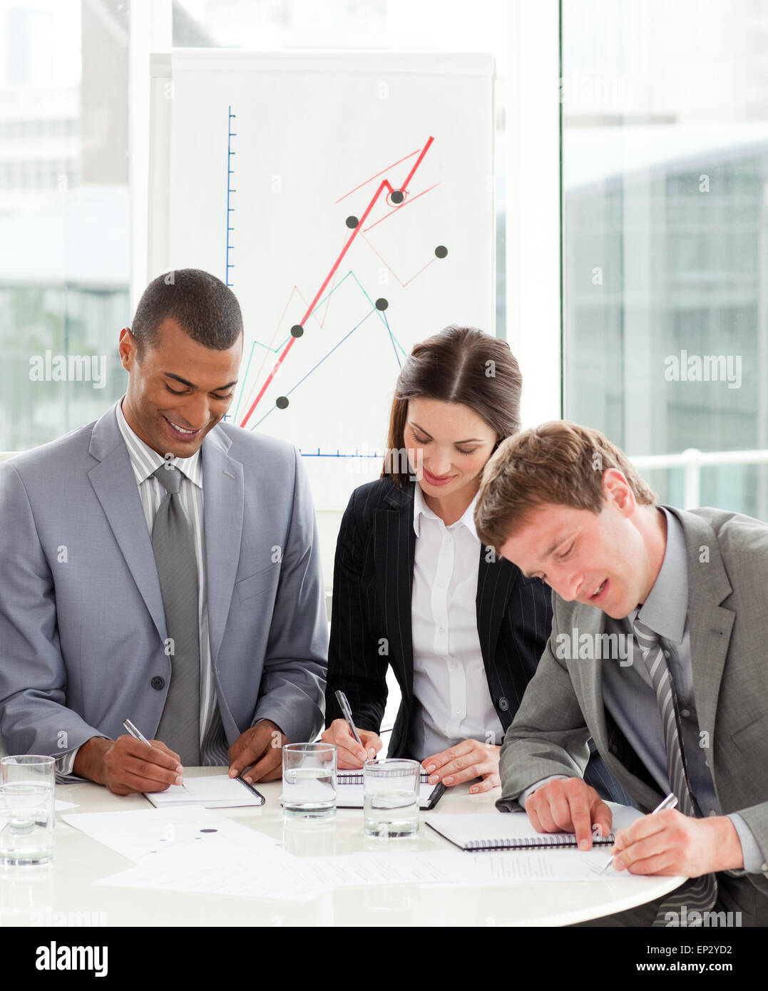 Concentrated business people working together Stock Photo - Alamy