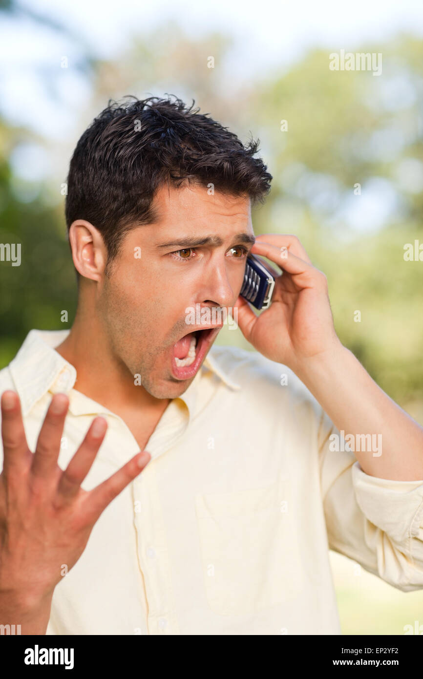 Man phoning in the park Stock Photo - Alamy
