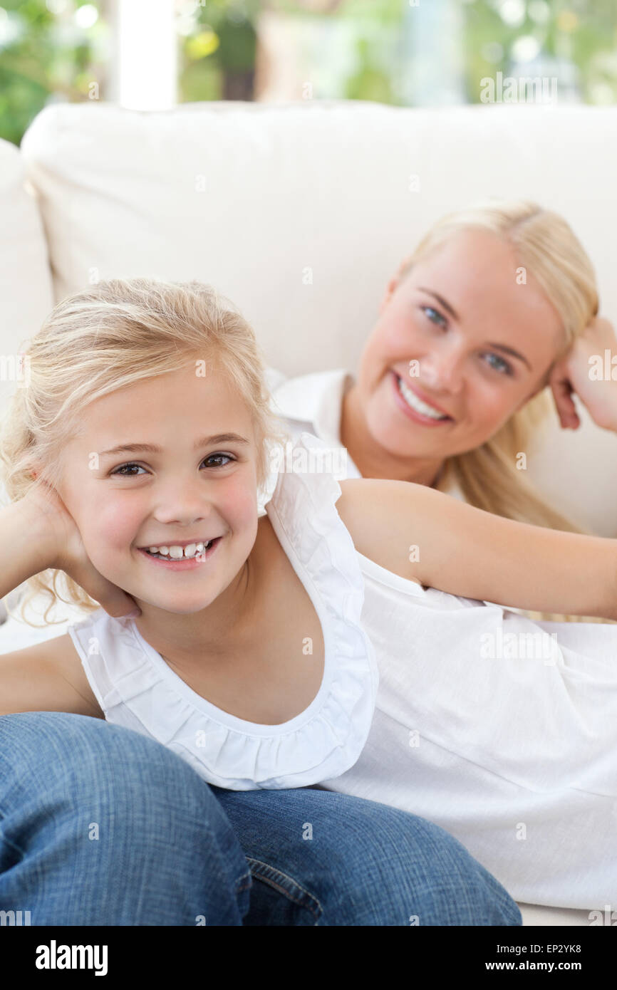 Beautiful woman lying down with her daughter Stock Photo - Alamy