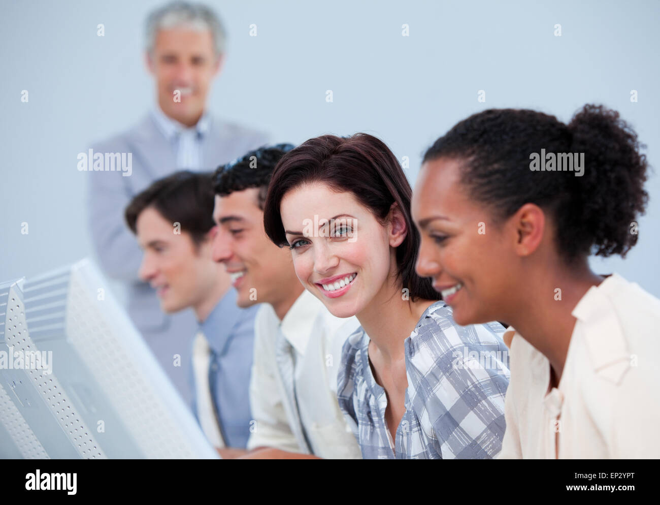 Positive business team at work with their manager Stock Photo - Alamy