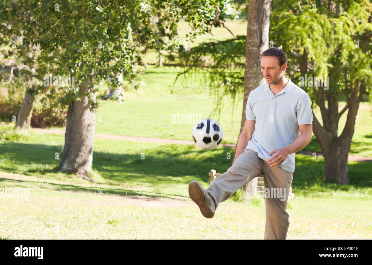 Handsome man with a ball Stock Photo - Alamy