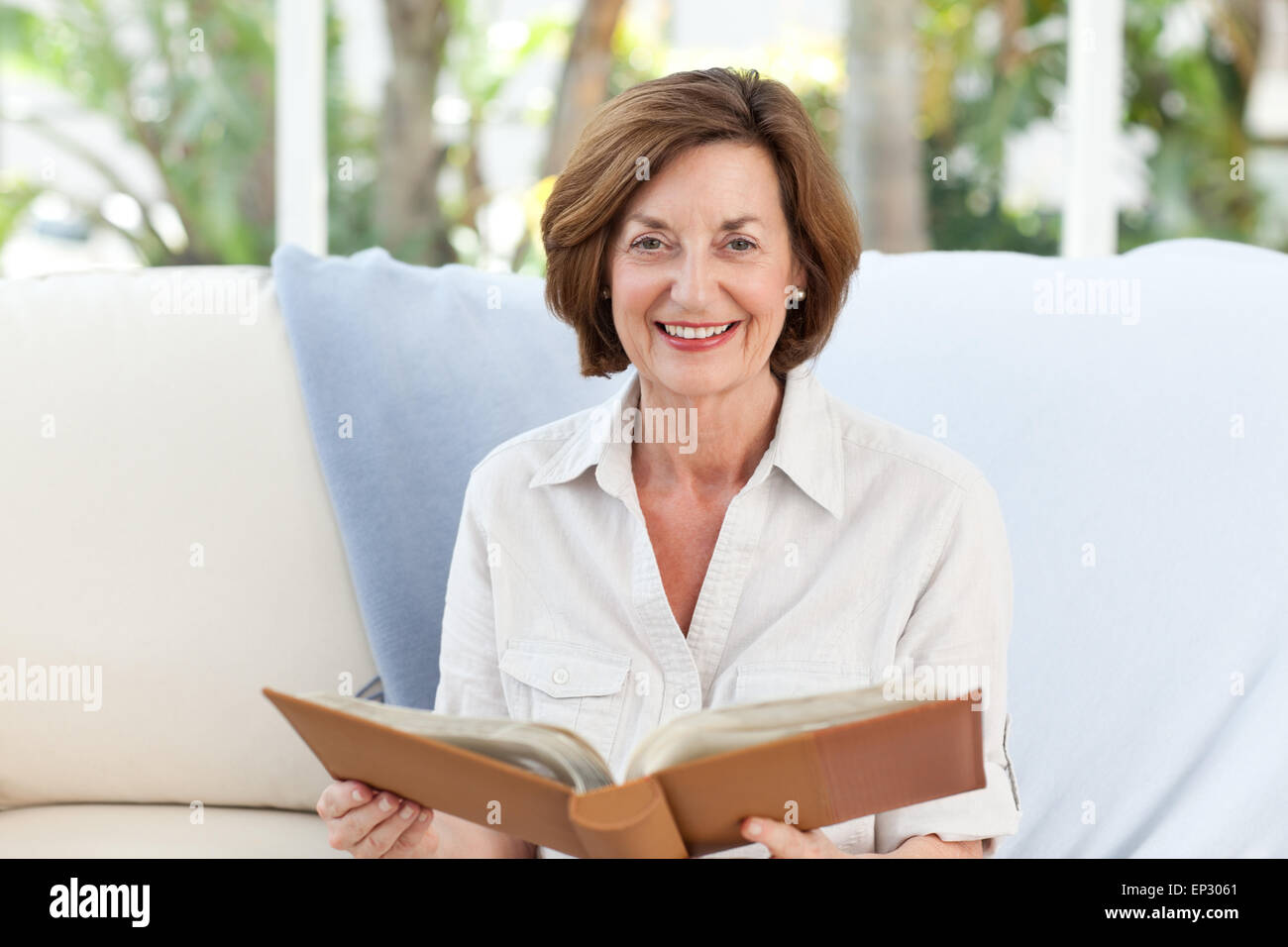 Old woman reading her book Stock Photo - Alamy