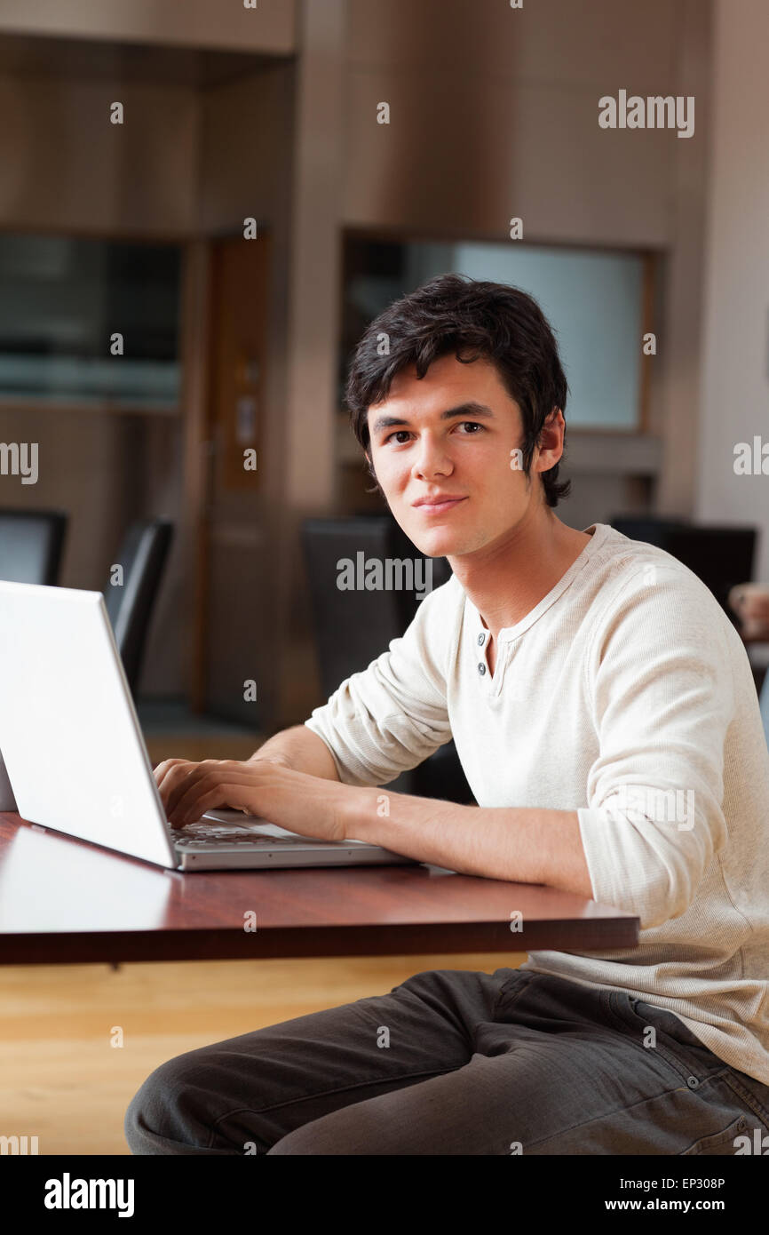 Portrait of a handsome man using a laptop Stock Photo - Alamy