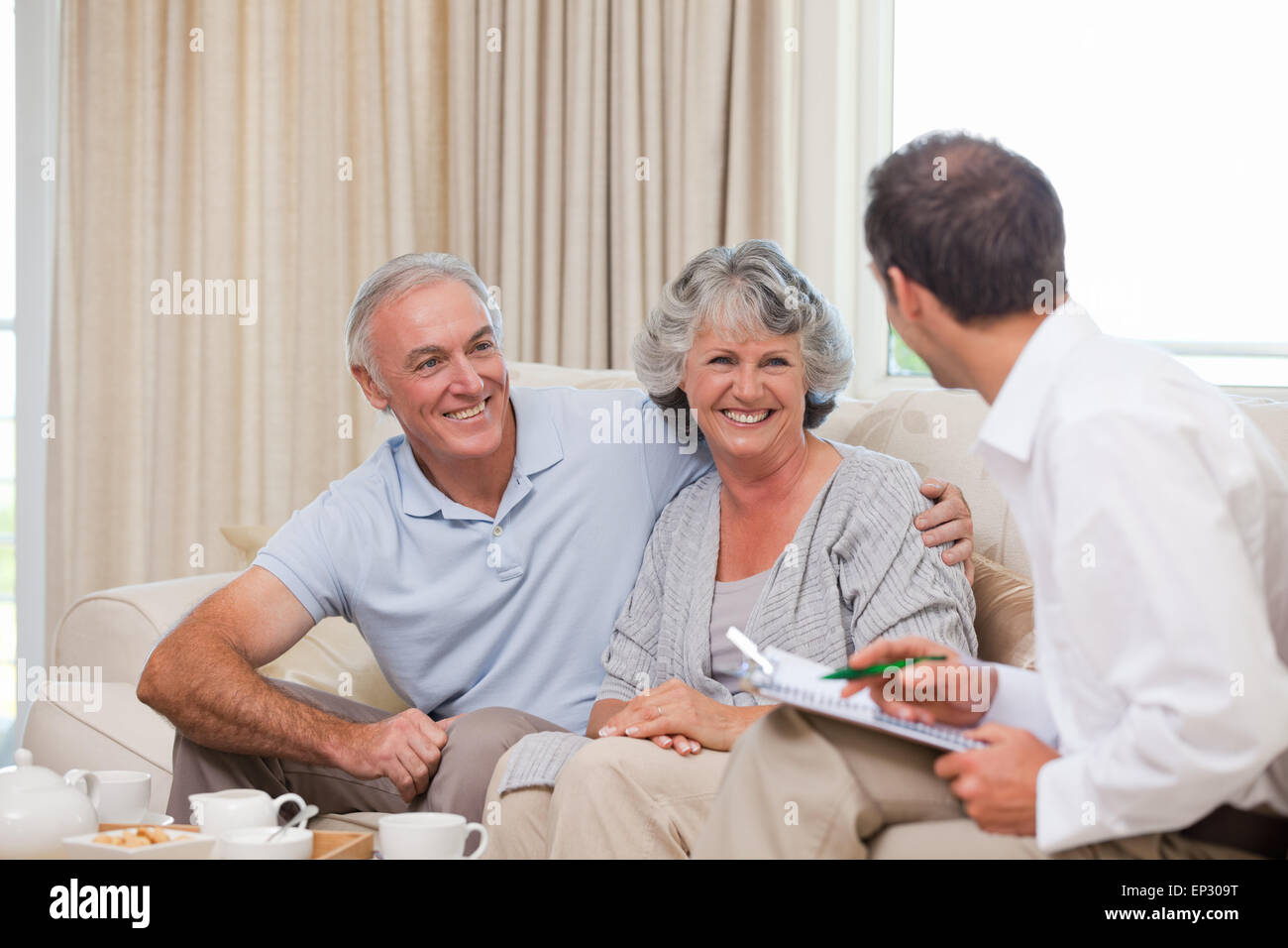 Seniors with assurance man Stock Photo - Alamy