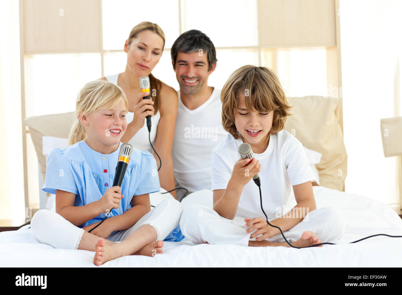 Animated family singing together Stock Photo - Alamy