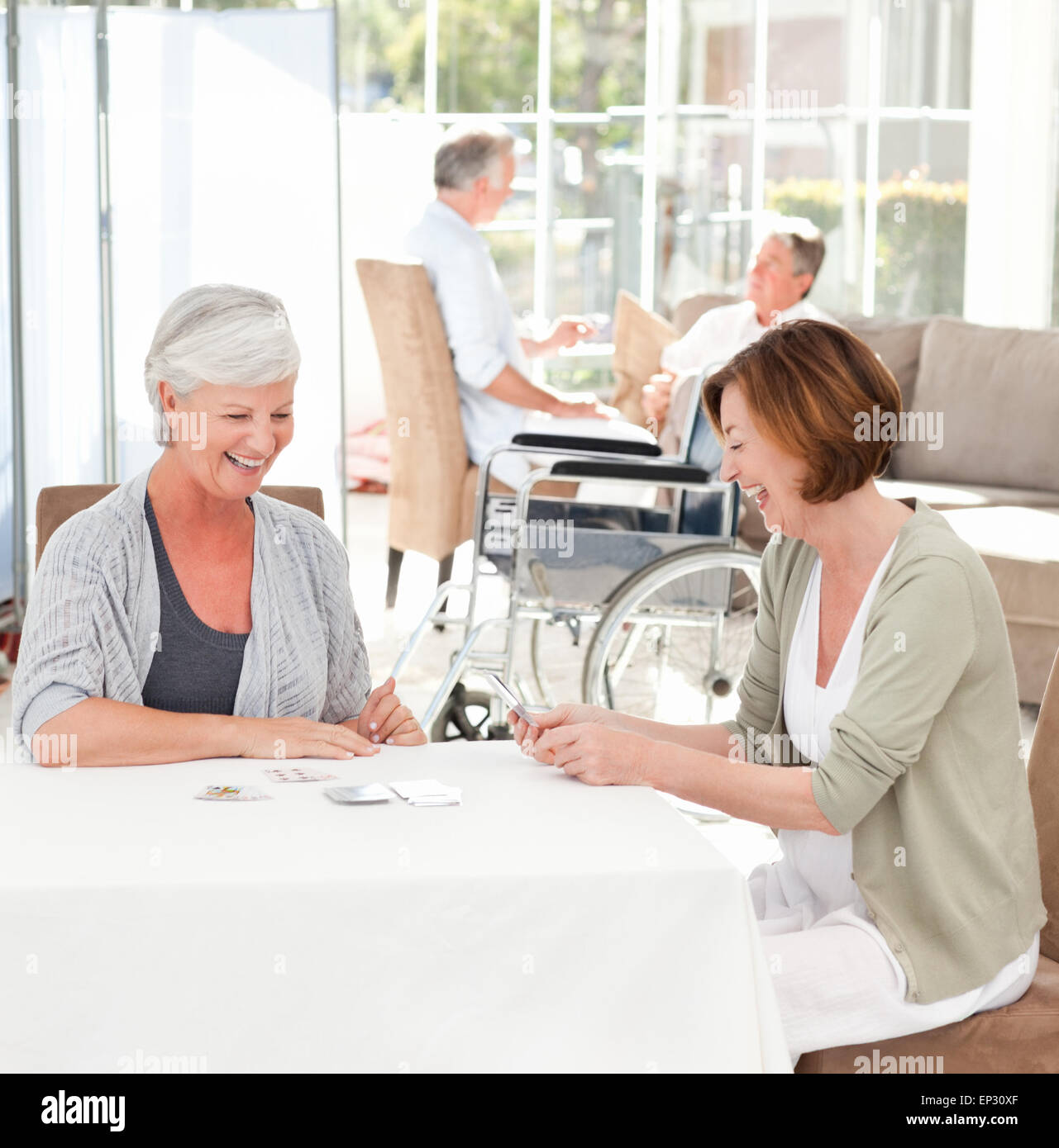 Women talking husbands playing cards hi-res stock photography and ...