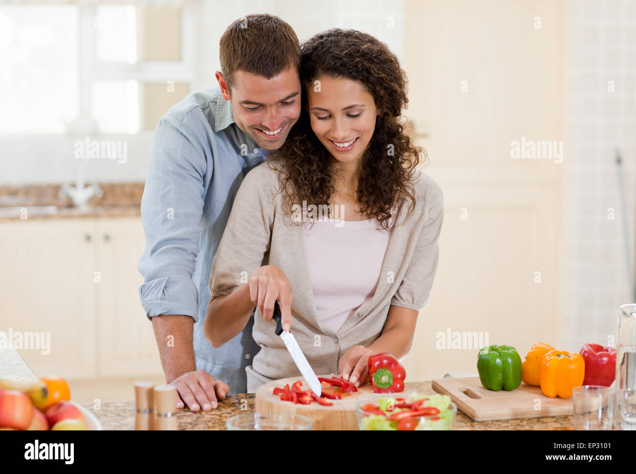 Handsome man cooking with his girlfriend Stock Photo - Alamy