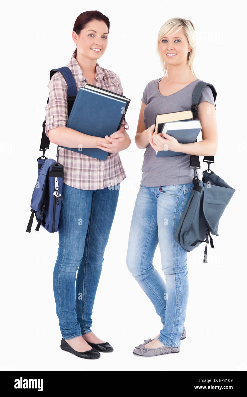 Portrait two students holding books hi-res stock photography and images ...